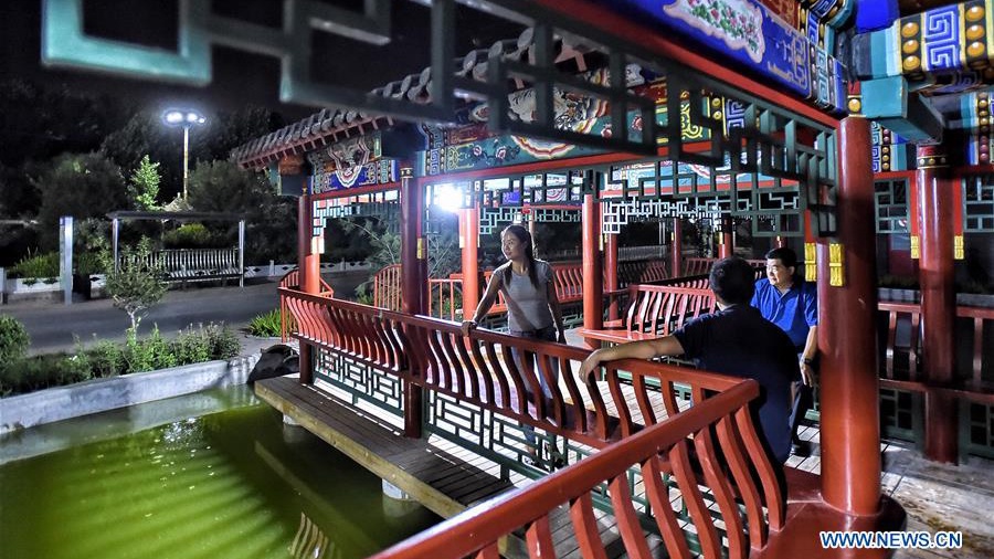 People attend night activities in Beijing