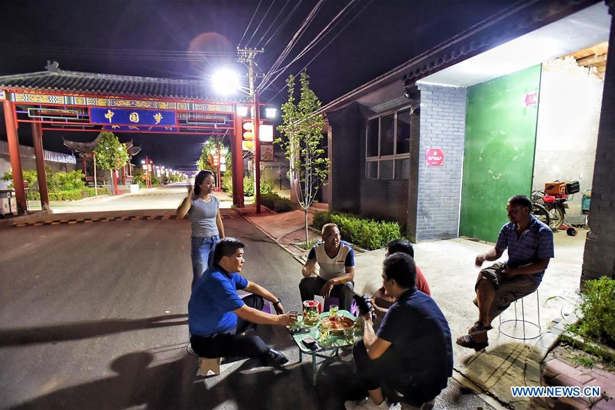 People attend night activities in Beijing