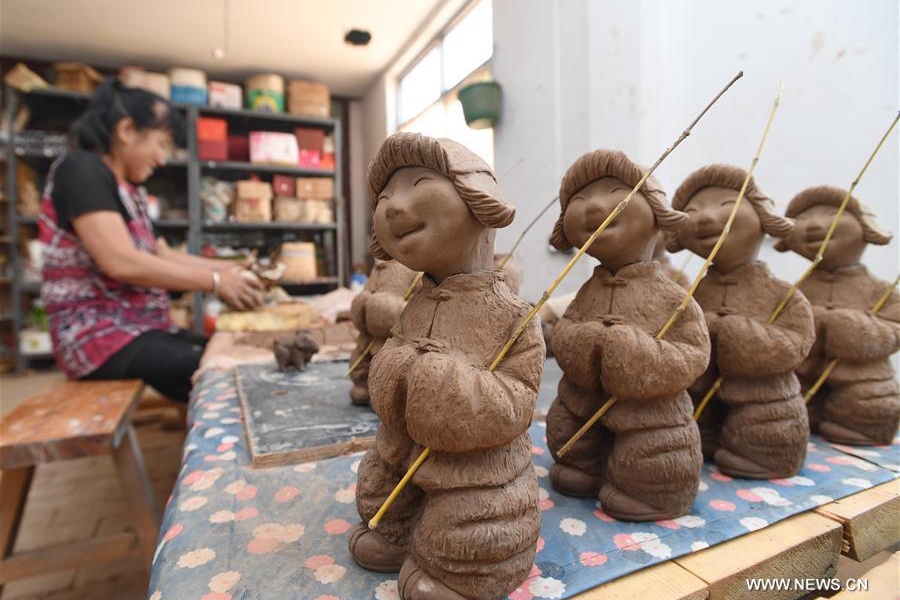 In pics: Sanchizhai clay sculpture N China