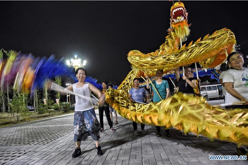 People attend night activities in Beijing